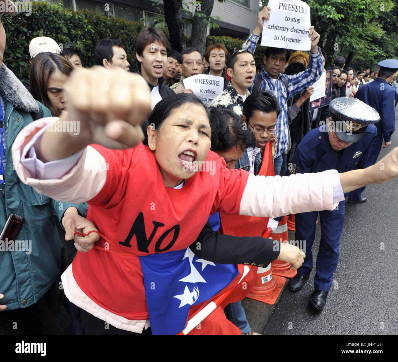 TOKYO, Japan - Myanmar residents stage a protest in front of the ...