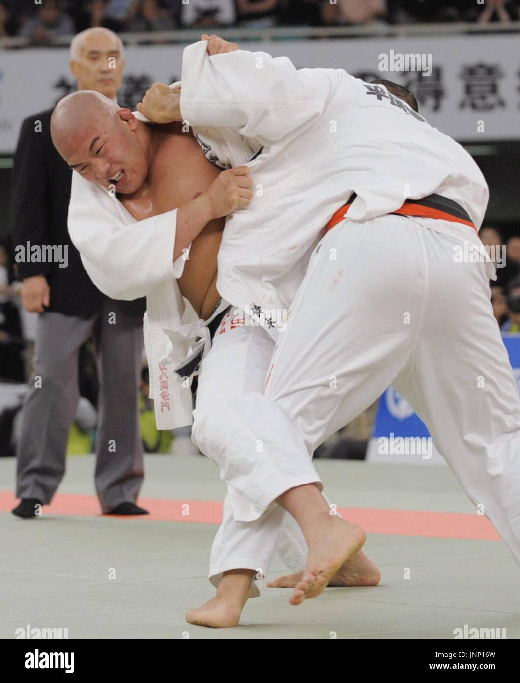 TOKYO, Japan - Satoshi Ishii (L) tackles archrival Keiji Suzuki in the ...
