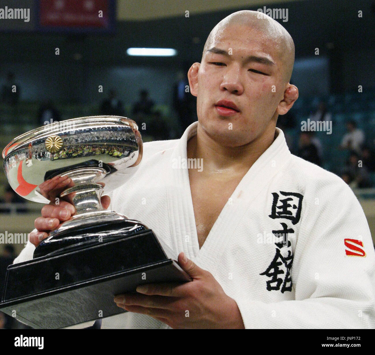 TOKYO, Japan - Satoshi Ishii holds up his trophy after winning his ...