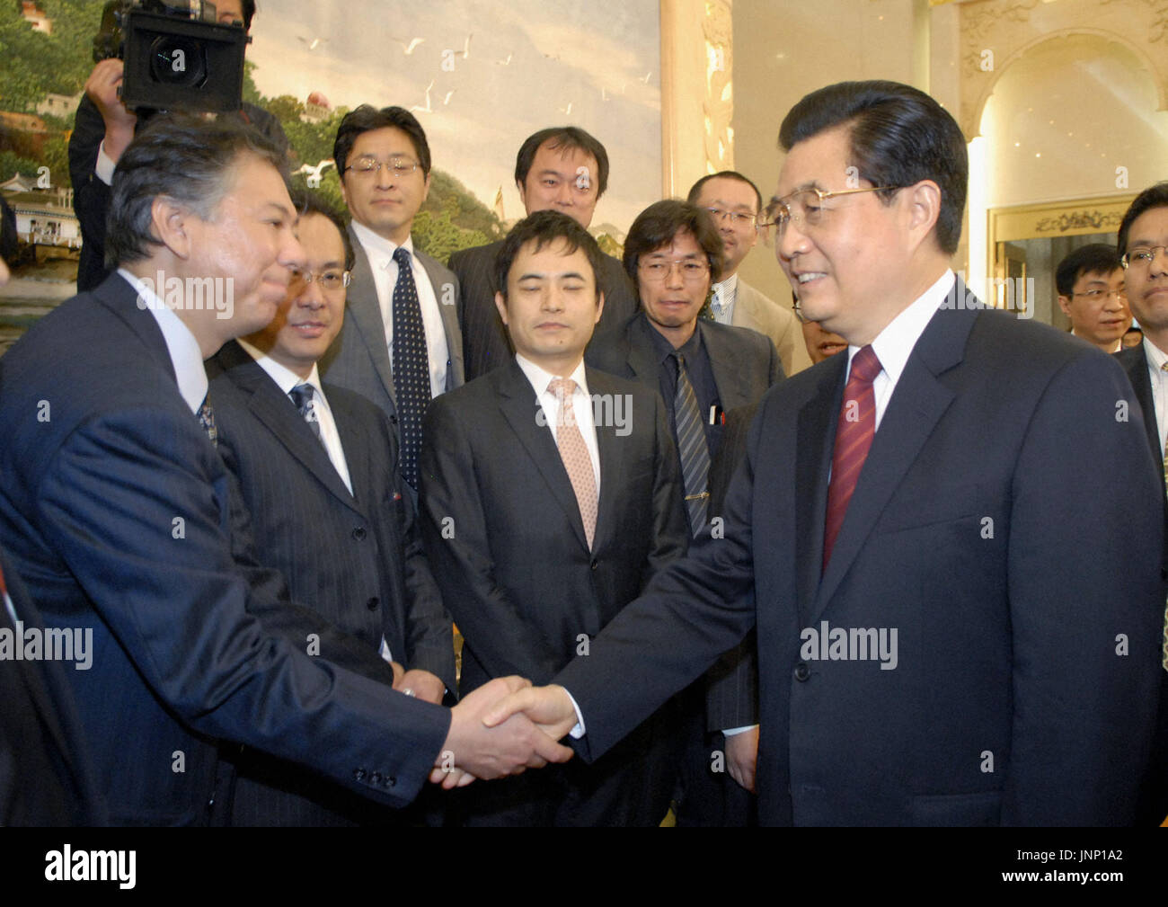 BEIJING, China - Chinese President Hu Jintao (R) shakes hands with ...
