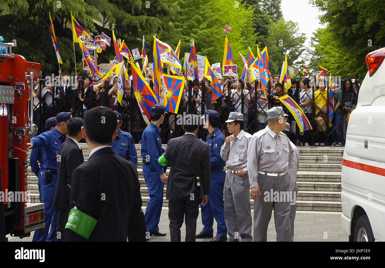 TOKYO, Japan - More than 100 students and protesters, some carrying ...