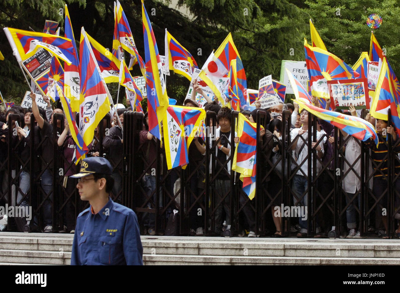 TOKYO, Japan - More than 100 students and protesters, some carrying ...