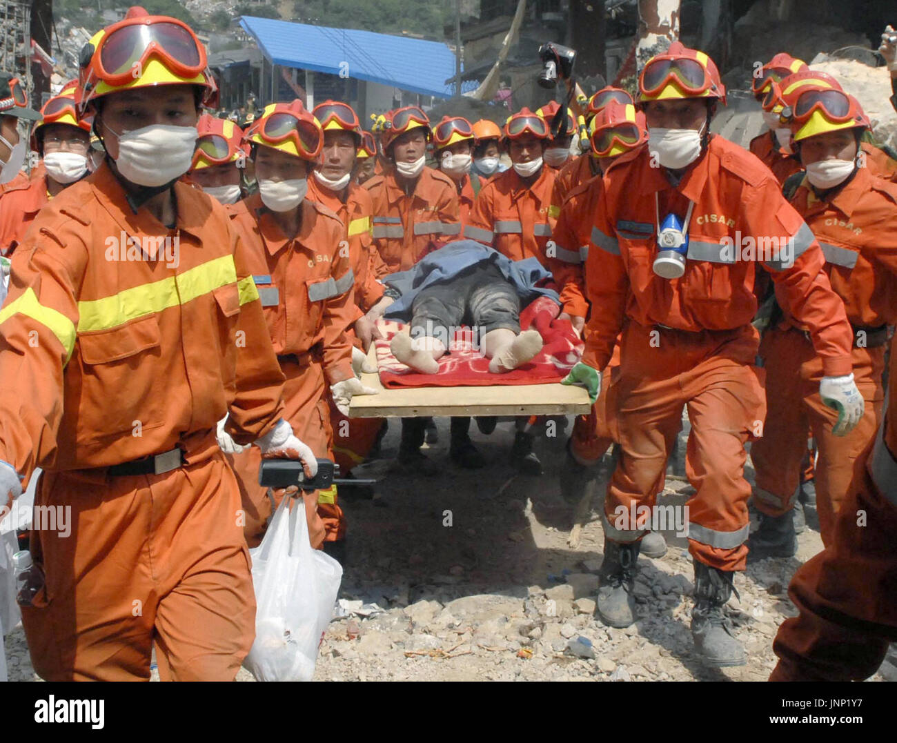 BEICHUAN, China - A woman is carried on a stretcher by a Chinese rescue ...