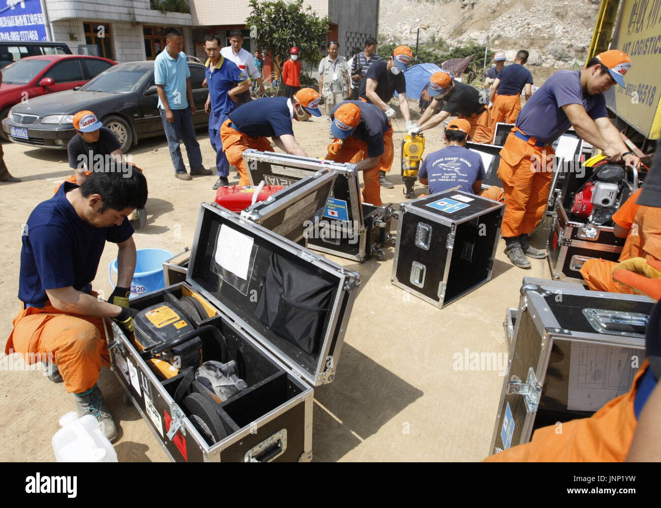 BEICHUAN, China - Japanese rescue workers pack up their equipment at ...
