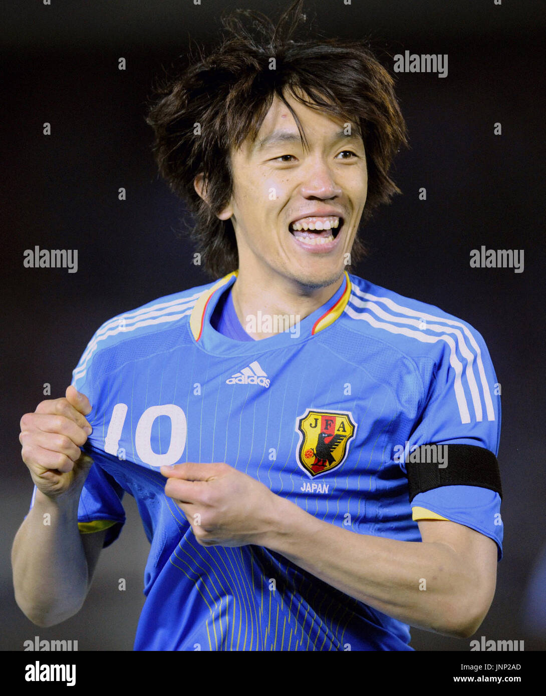 YOKOHAMA, Japan - Midfielder Shunsuke Nakamura is all smiles after ...