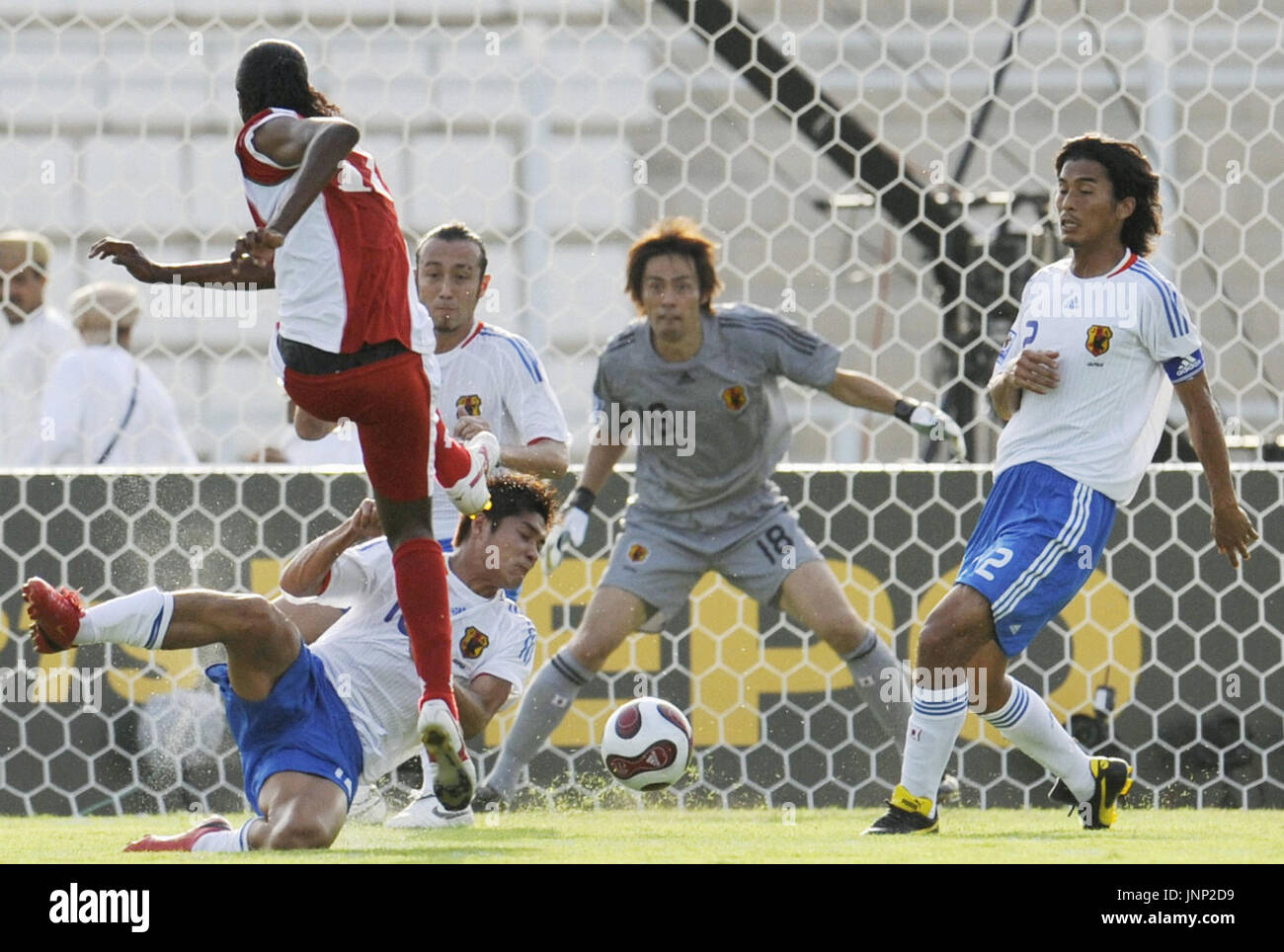 MUSCAT, Oman - Oman's Ahmed Mubarak (L in front) scores the opening ...