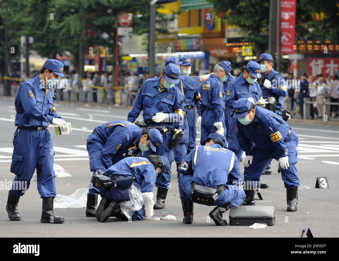 TOKYO, Japan - Police examine the site of a stabbing rampage in Tokyo's ...
