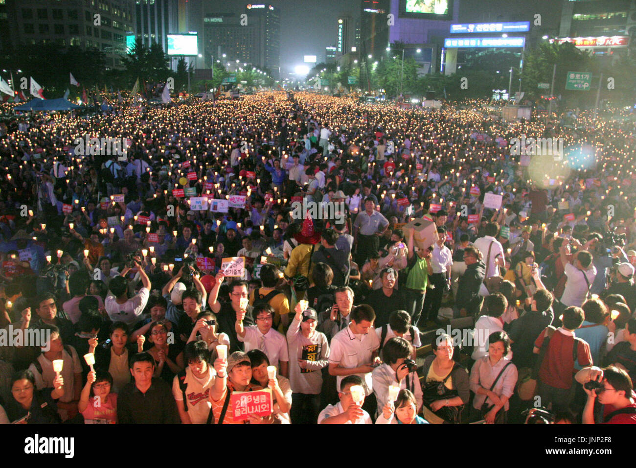 SEOUL, South Korea - Tens of thousands of people stage a candlelight ...