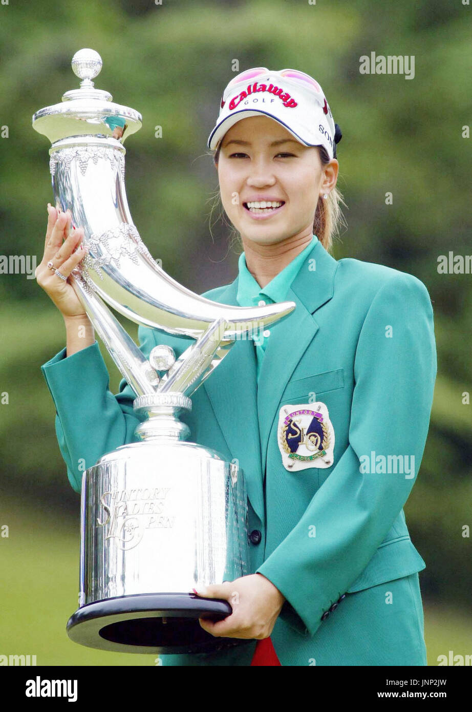 KOBE, Japan - Momoko Ueda poses with the winner's trophy after winning ...