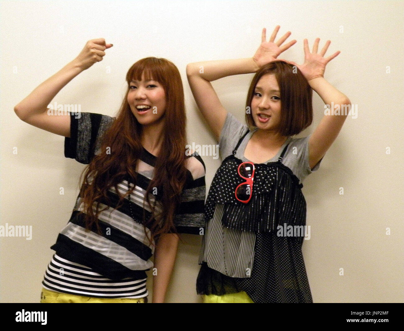 TOKYO, Japan - Haruka (L) and Yukari (R), a Japanese female hip-hop duo HALCALI, pose after an ...
