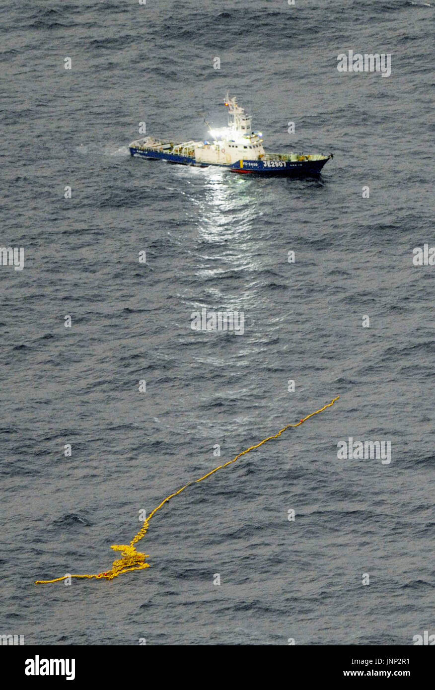 CHIBA, Japan - A consort vessel searches for a fishing boat manned by ...