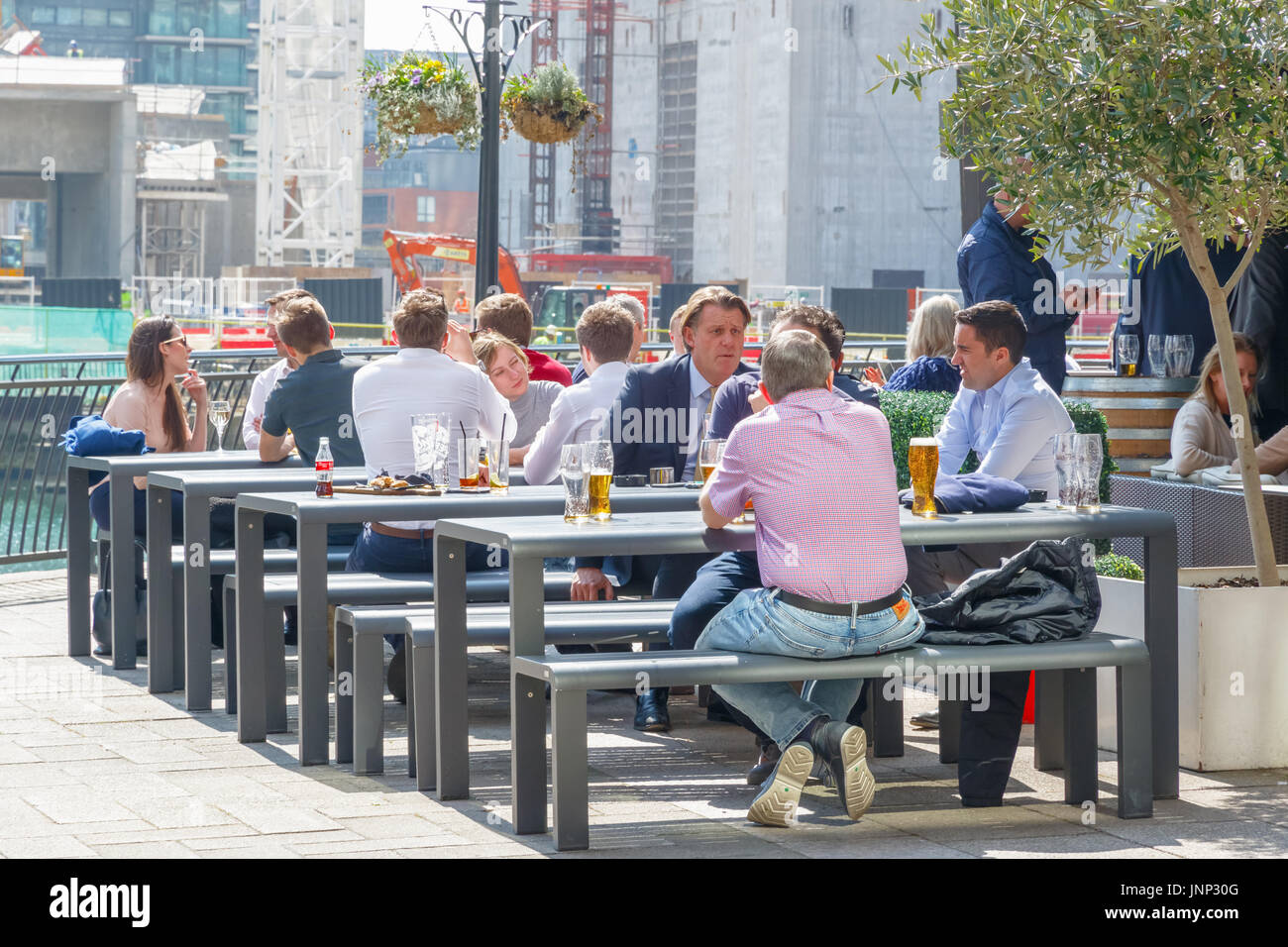 London, UK - May 10, 2017 - Dockside bar in Canary Wharf packed with ...