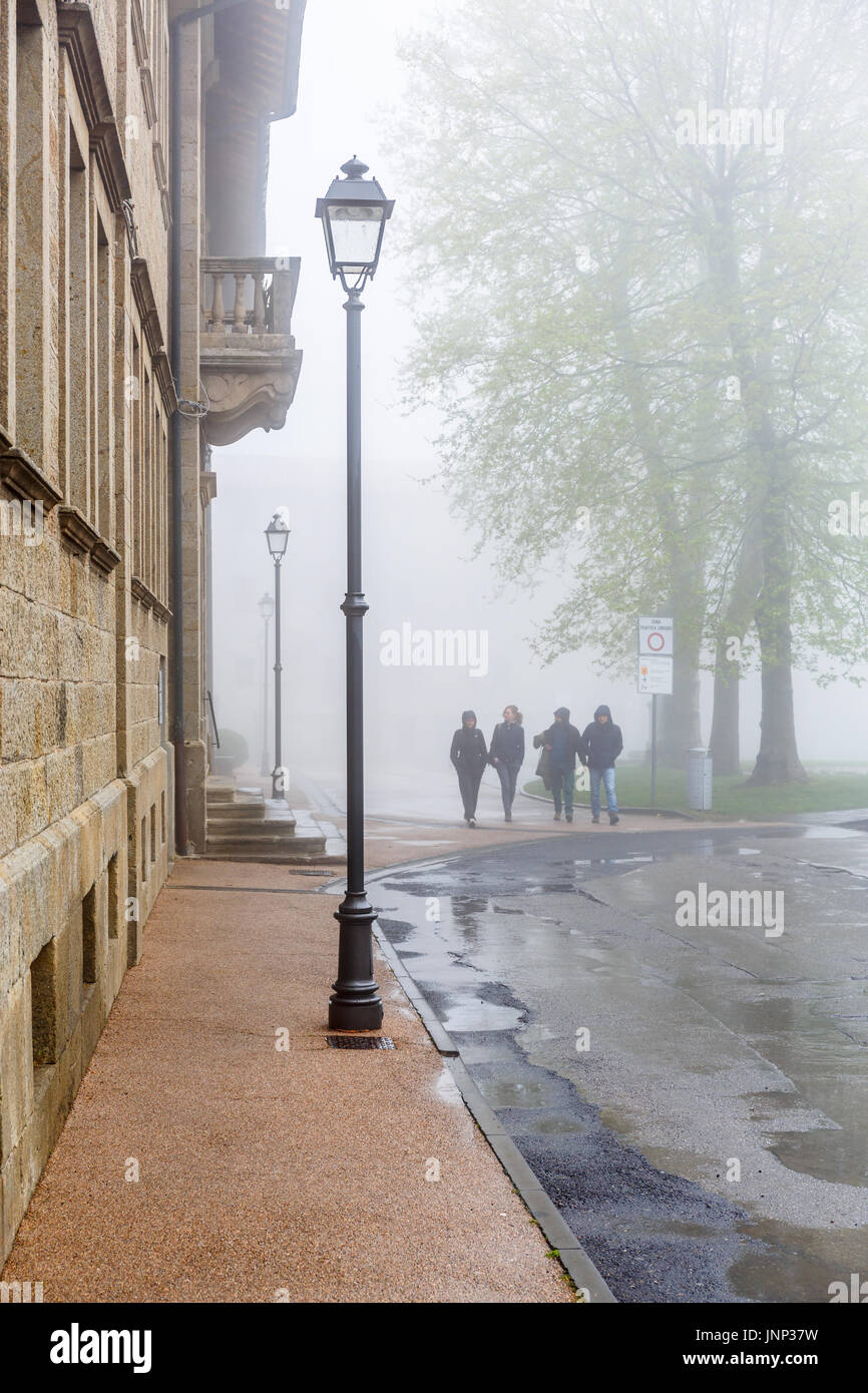 Foggy city street with people walking Stock Photo - Alamy