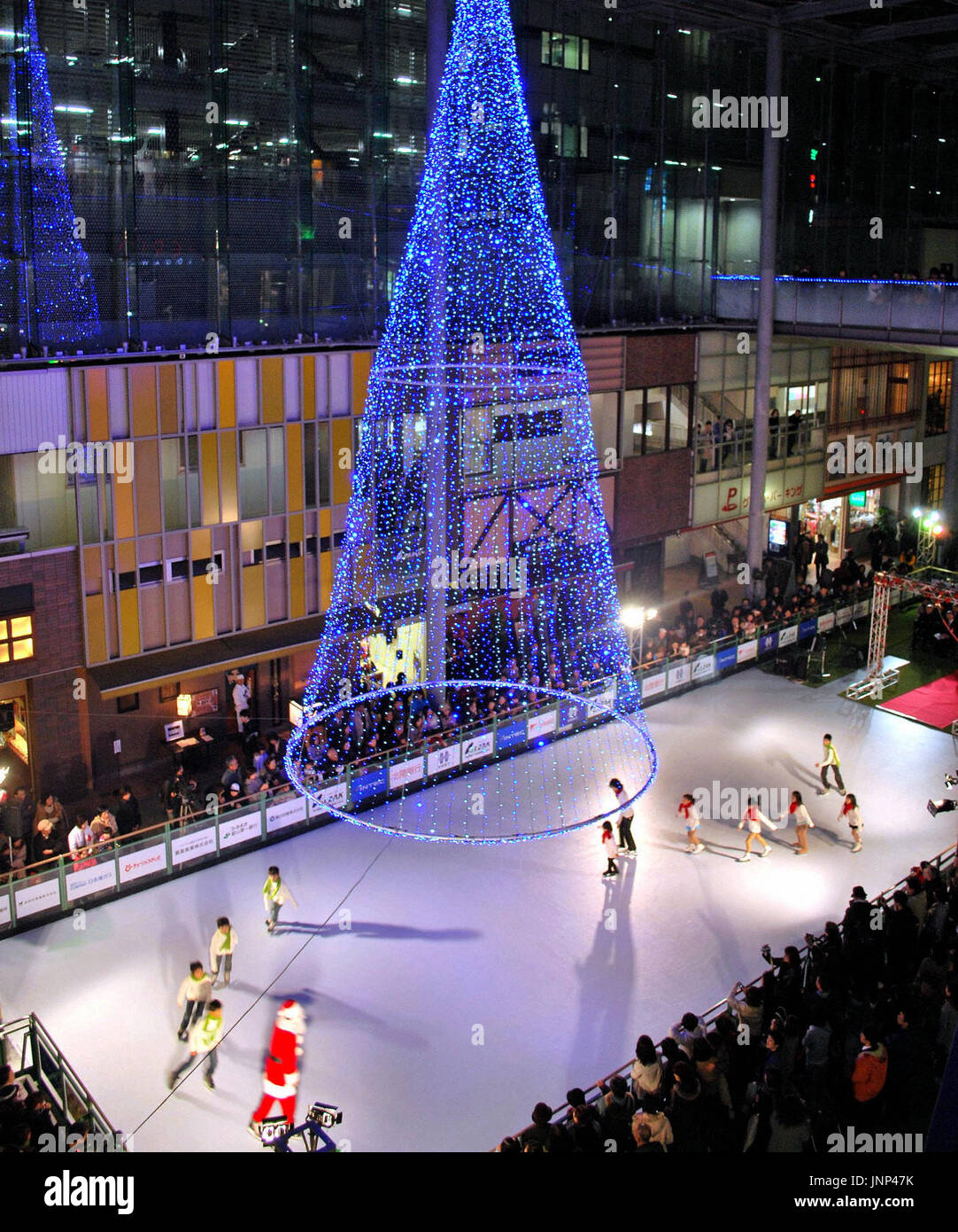 TOYAMA, Japan - Children skate on a rink made of resin panels opened by ...