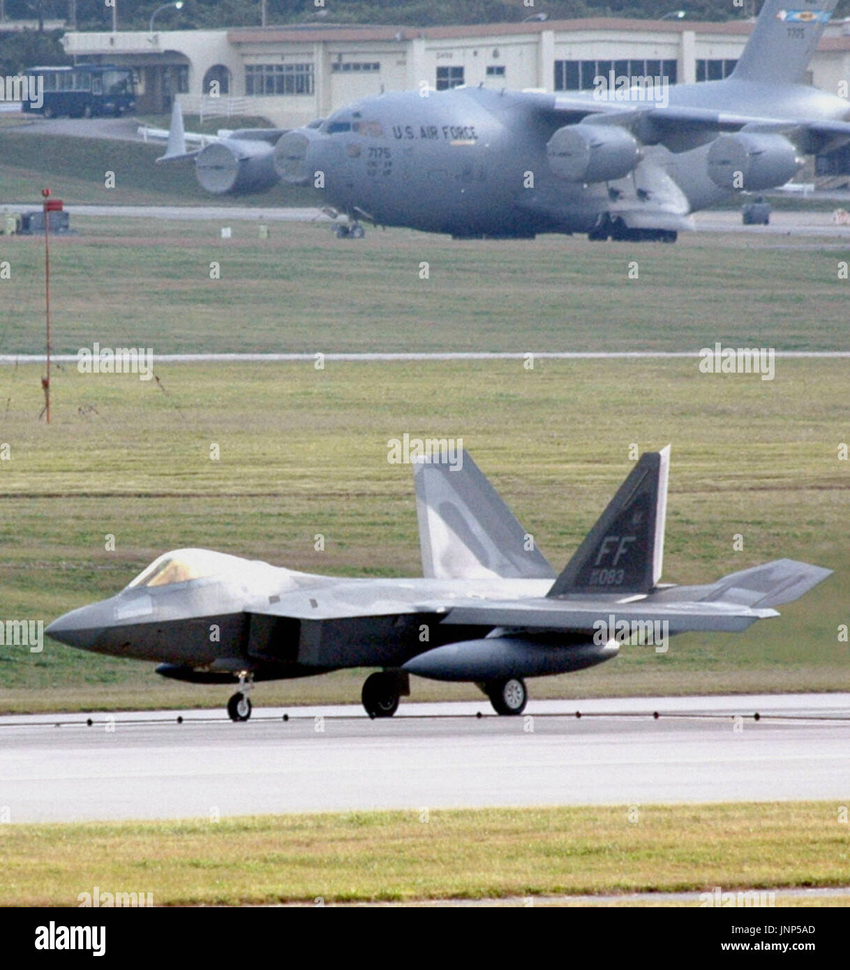 NAHA, Japan - A U.S. F-22A Raptor stealth fighter (foreground) arrives ...