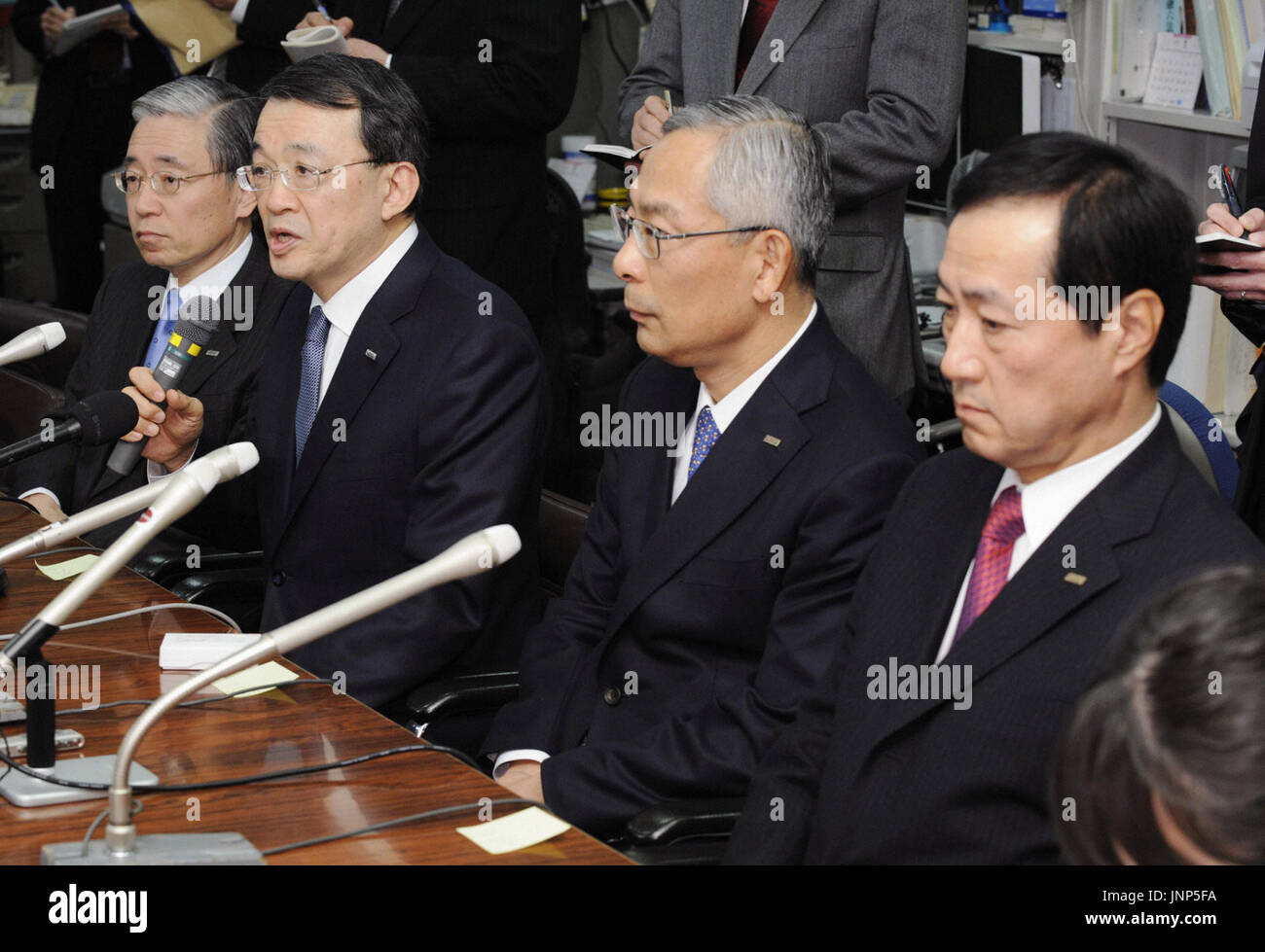 TOKYO, Japan - (From left) Terunobu Maeda, current president of Mizuho ...