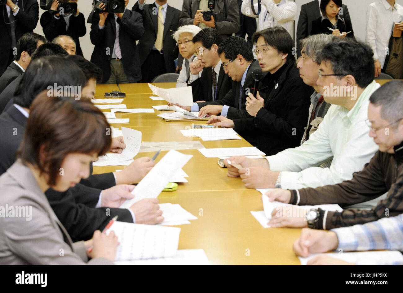 TOKYO, Japan - Makoto Yuasa (4th from R, holding microphone), the ...