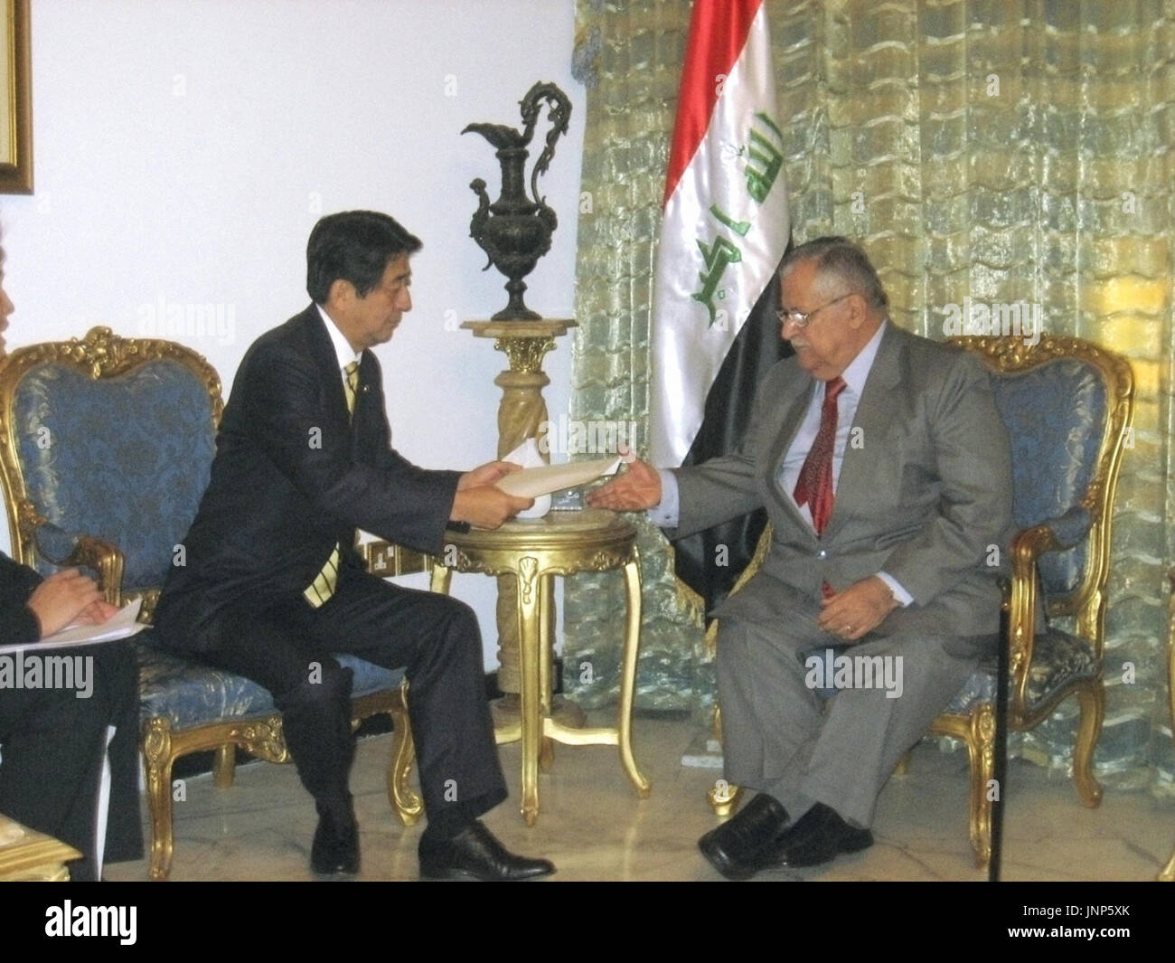 BAGHDAD, Iraq - Former Prime Minister Shinzo Abe (L), on a visit to ...