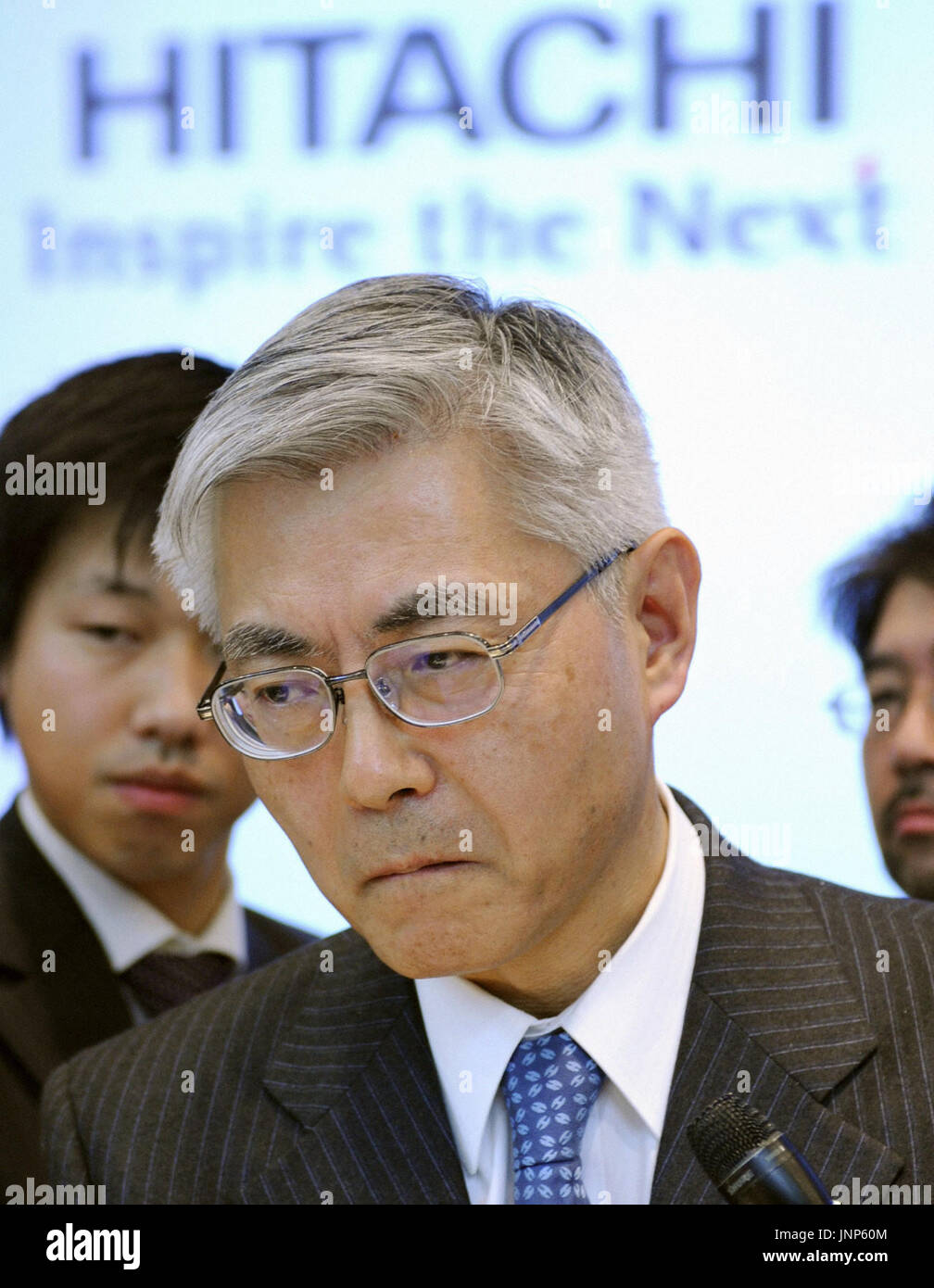 TOKYO, Japan - Hitachi Ltd. President Kazuo Furukawa appears solemn ...
