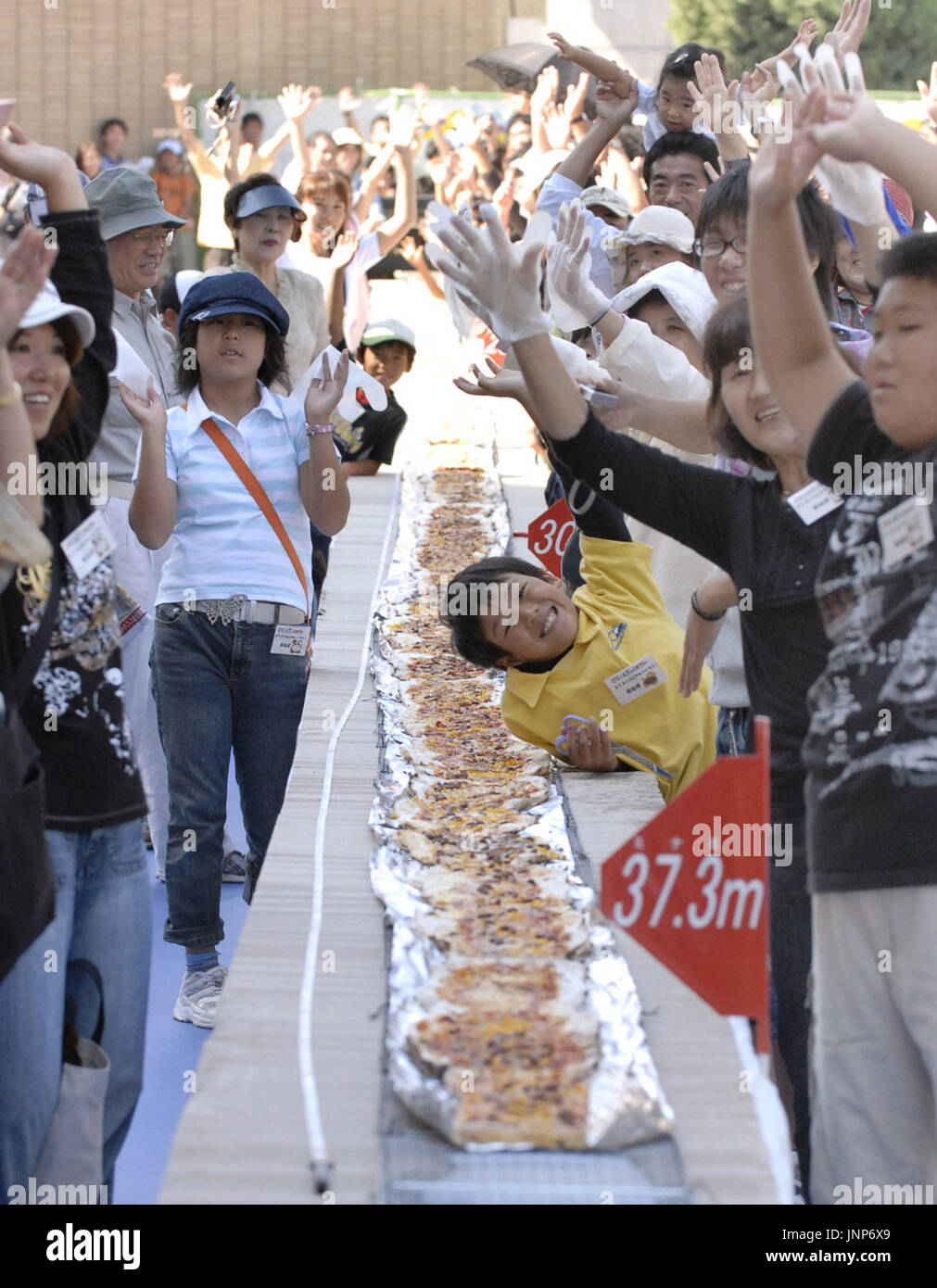 OSAKA, Japan - Residents in Minami, Osaka, celebrate after they managed ...