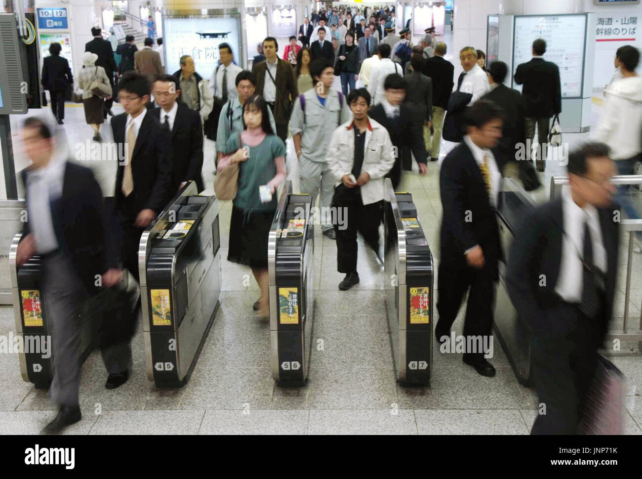 TOKYO, Japan - Passengers pass through ticket gates at no charge Oct ...