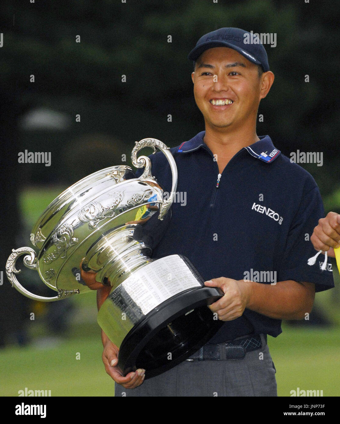 SAGAMIHARA, Japan - Toru Taniguchi smiles with his cup in hands after ...