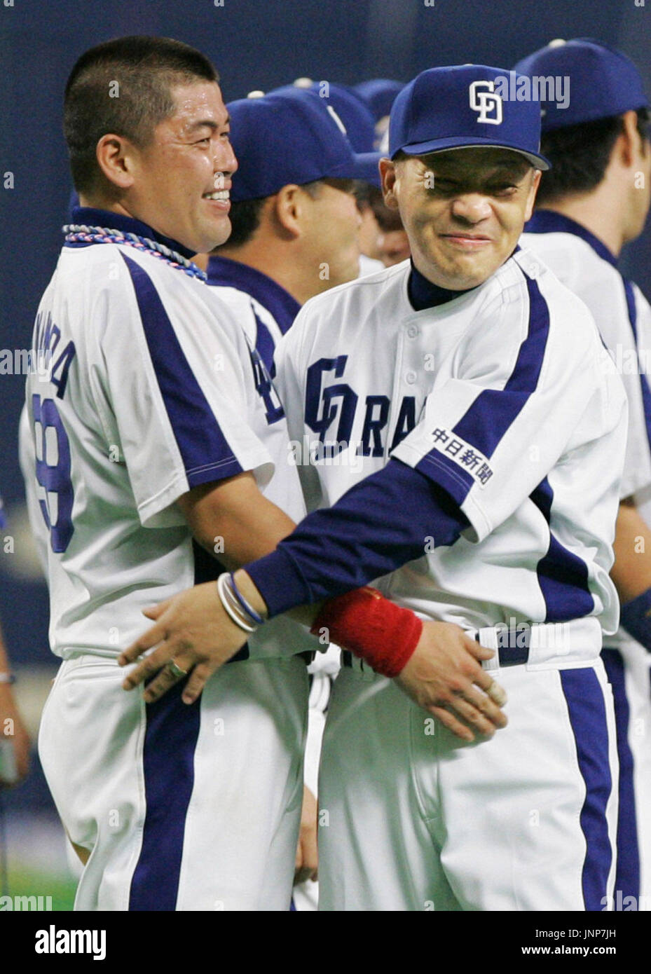 NAGOYA, Japan - Photo shows Chunichi Dragons manager Hiromitsu Ochiai (R) hugging his team's ...