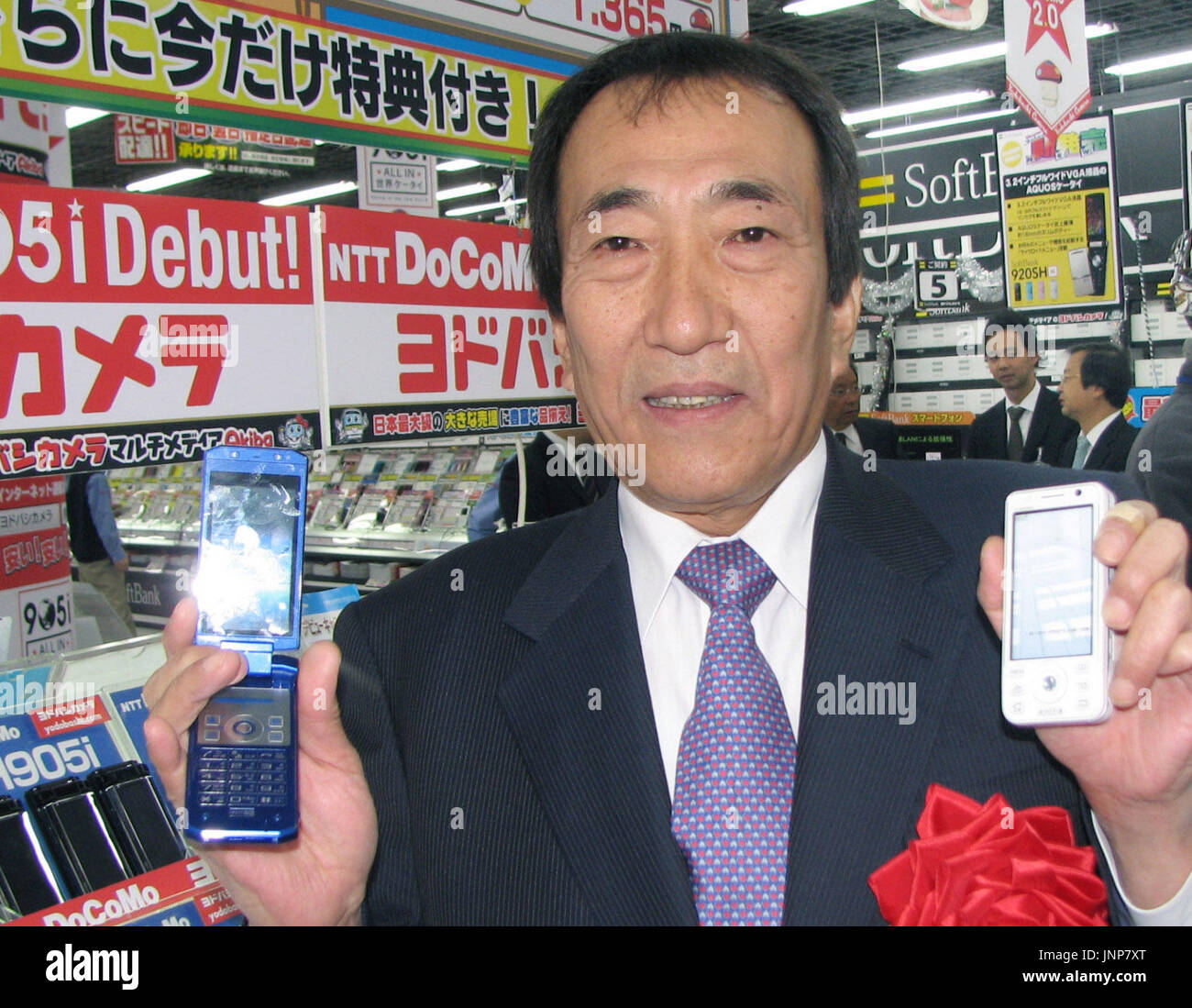 TOKYO, Japan - NTT DoCoMo Inc. President Masao Nakamura unveils a new ...