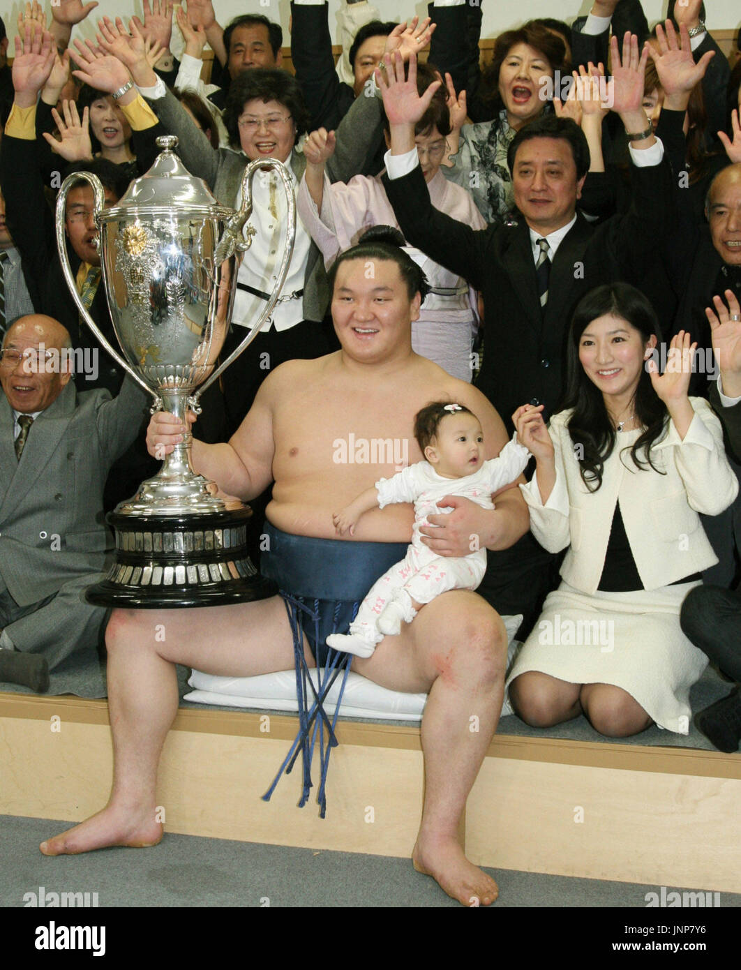 FUKUOKA, Japan - Mongolian grand champion Hakuho celebrates his fifth ...