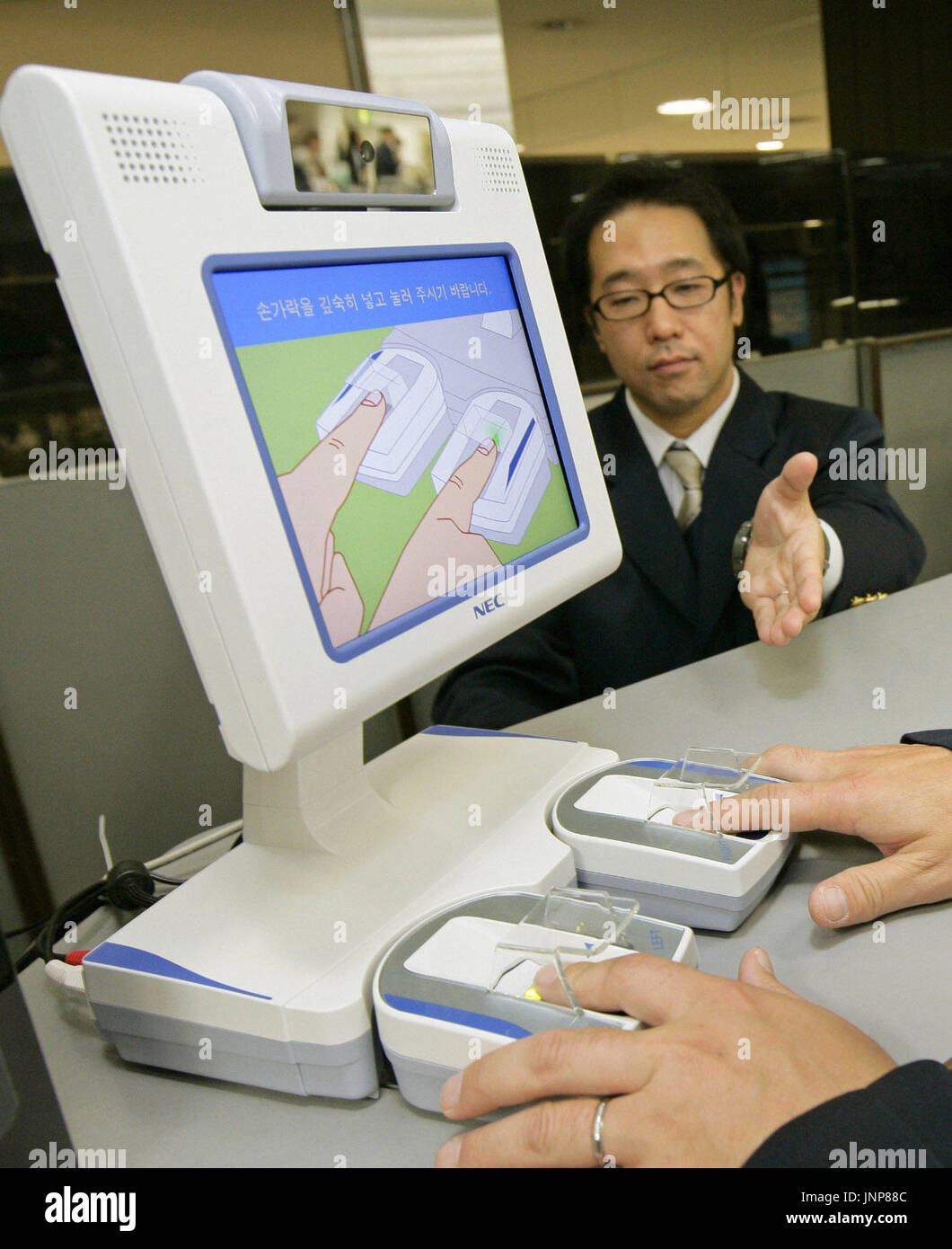 NARITA, Japan - The Immigration Bureau put a new fingerprinting and ...