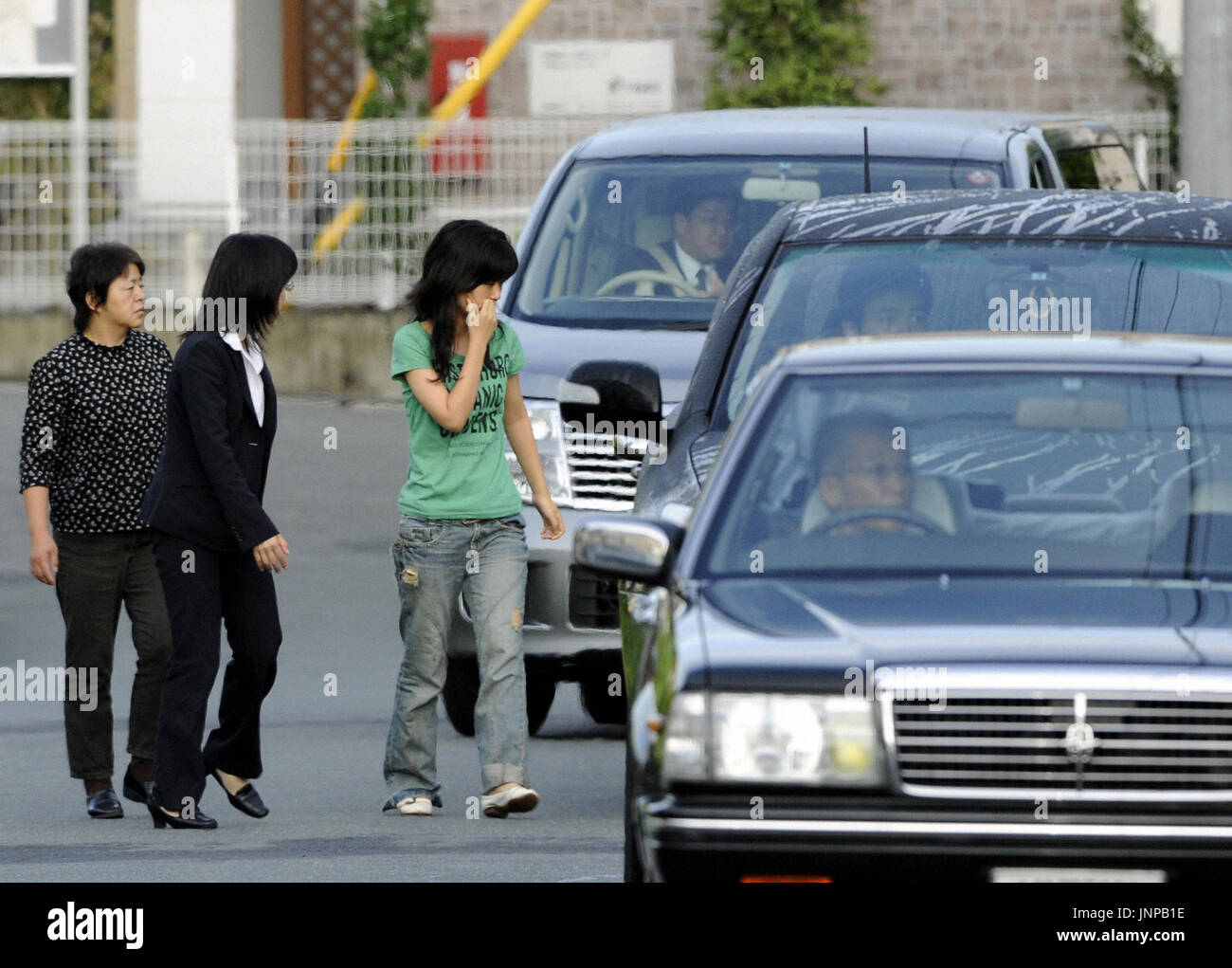 KAKEGAWA, Japan - Junko Ito (far L), the mother of Kazuya Ito, a ...