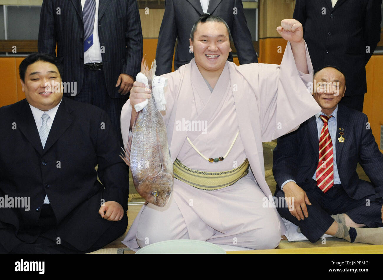 TOKYO, Japan - Mongolian yokozuna (grand champion Hakuho (C) celebrates ...