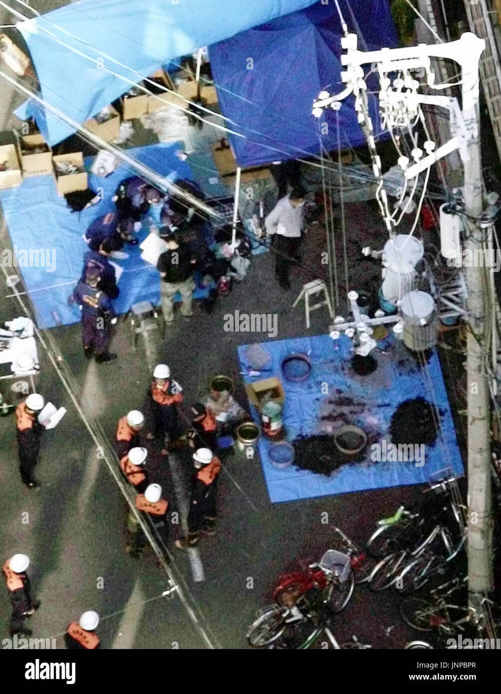 Osaka Japan Police Investigators Inspect A Video Parlor In Osaka On