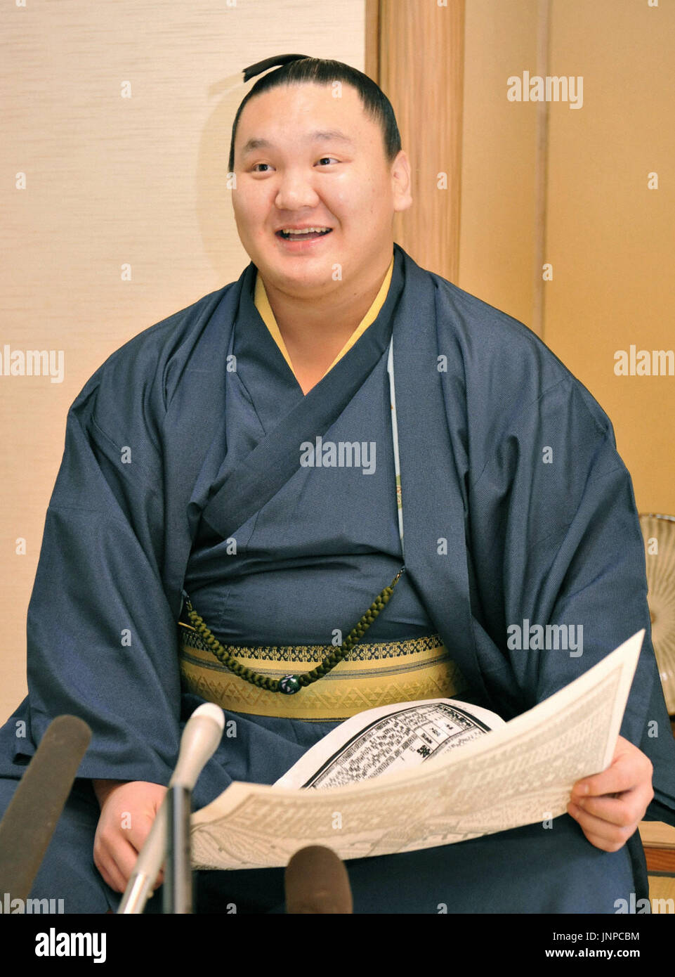 FUKUOKA, Japan - Mongolian yokozuna (grand champion) Hakuho smiles ...