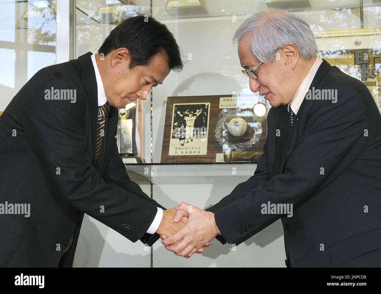 TOKYO, Japan - Japanese baseball commissioner Ryozo Kato (R) and ...
