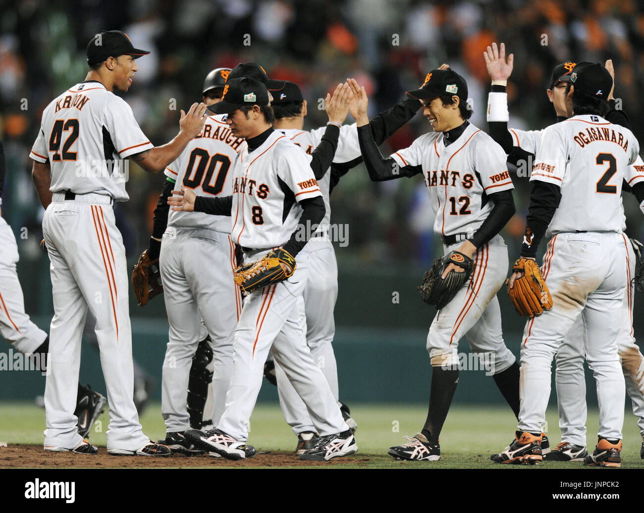 TOKOROZAWA, Japan - Yomiuri Giants players celebrate their 6-4 victory ...