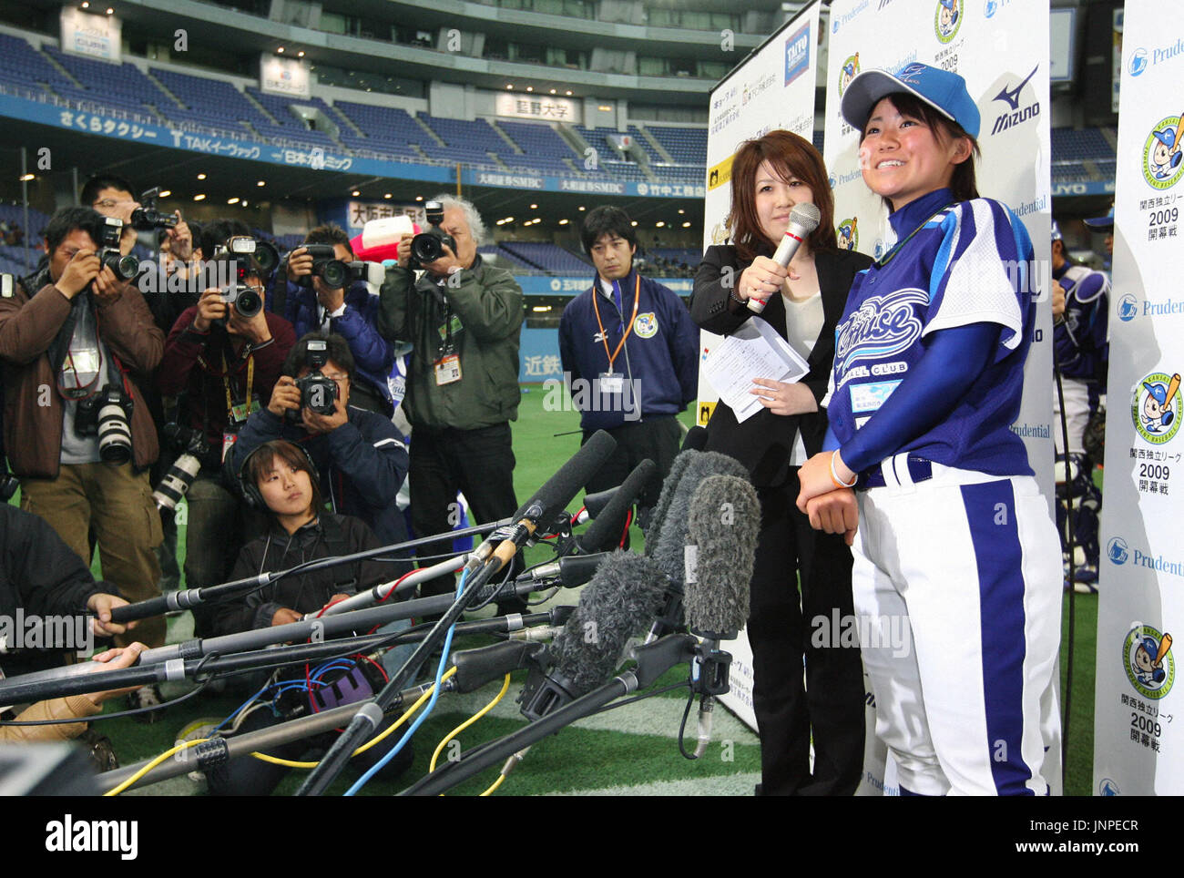 OSAKA, Japan - Kobe 9 Cruise pitcher Eri Yoshida (R) speaks to ...