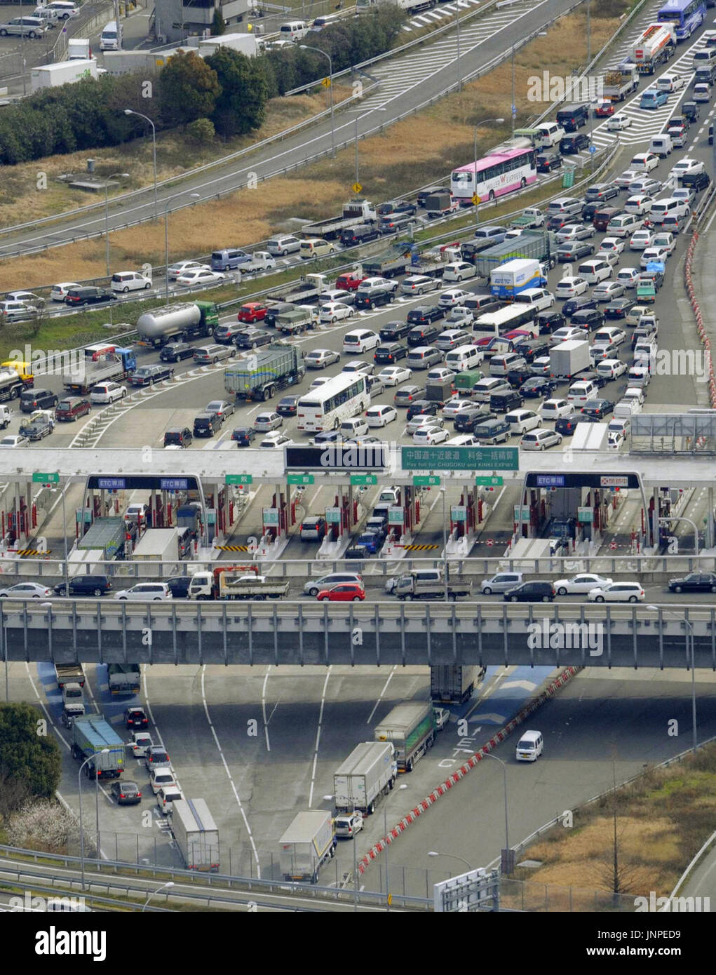 OSAKA, Japan - A tollgate at the Suita interchange in Osaka is crowded ...