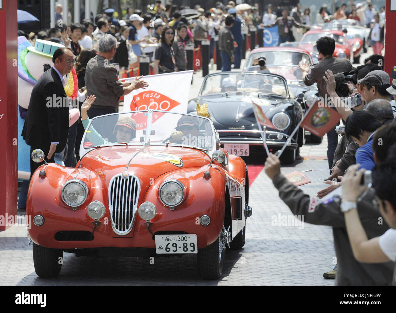 OSAKA, Japan - About 70 classic cars took paraded along a street in the ...