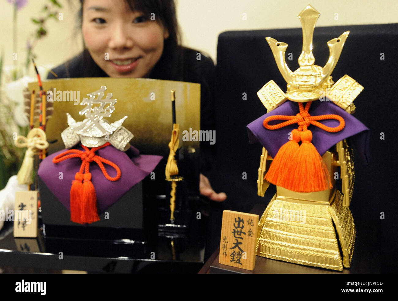 TOKYO, Japan - Precious metal shop Ginza Tanaka showcases a golden mini ...