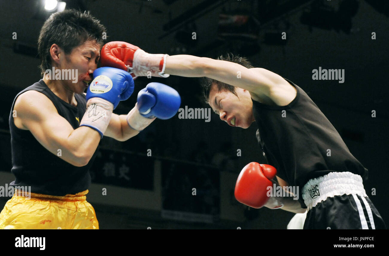 TOKYO, Japan - Japanese champion Momo Koseki (R) delivers a punch to ...