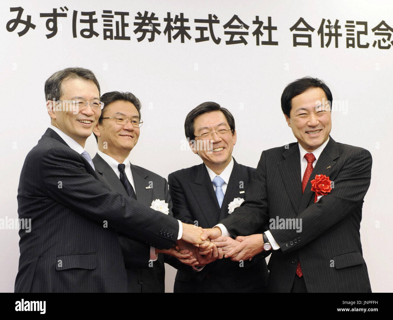TOKYO, Japan - (From L to R) Takashi Tsukamoto, president of Mizuho Financial Group Inc ...