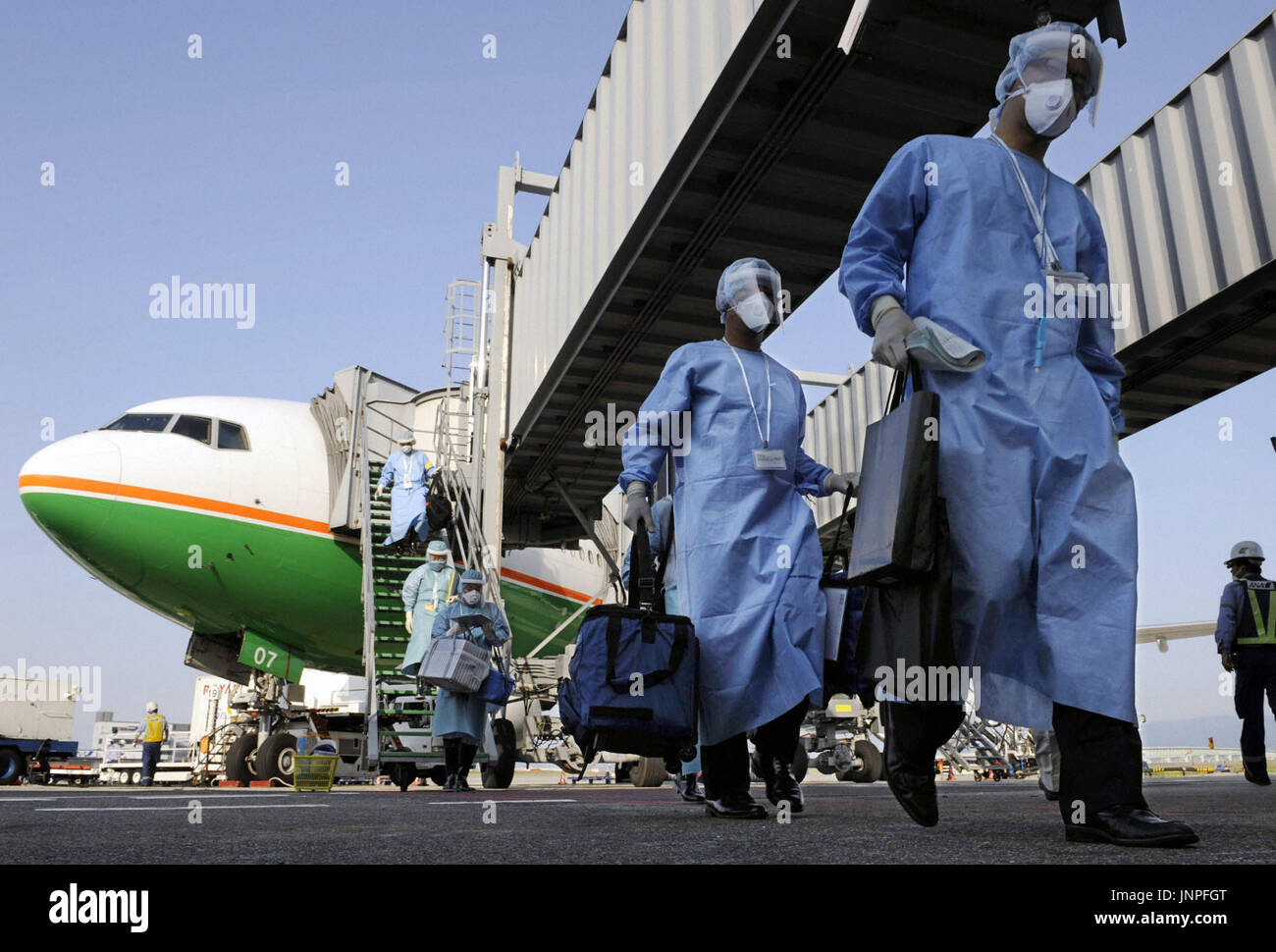 OSAKA, Japan - Quarantine officers head back to the terminal at Kansai ...