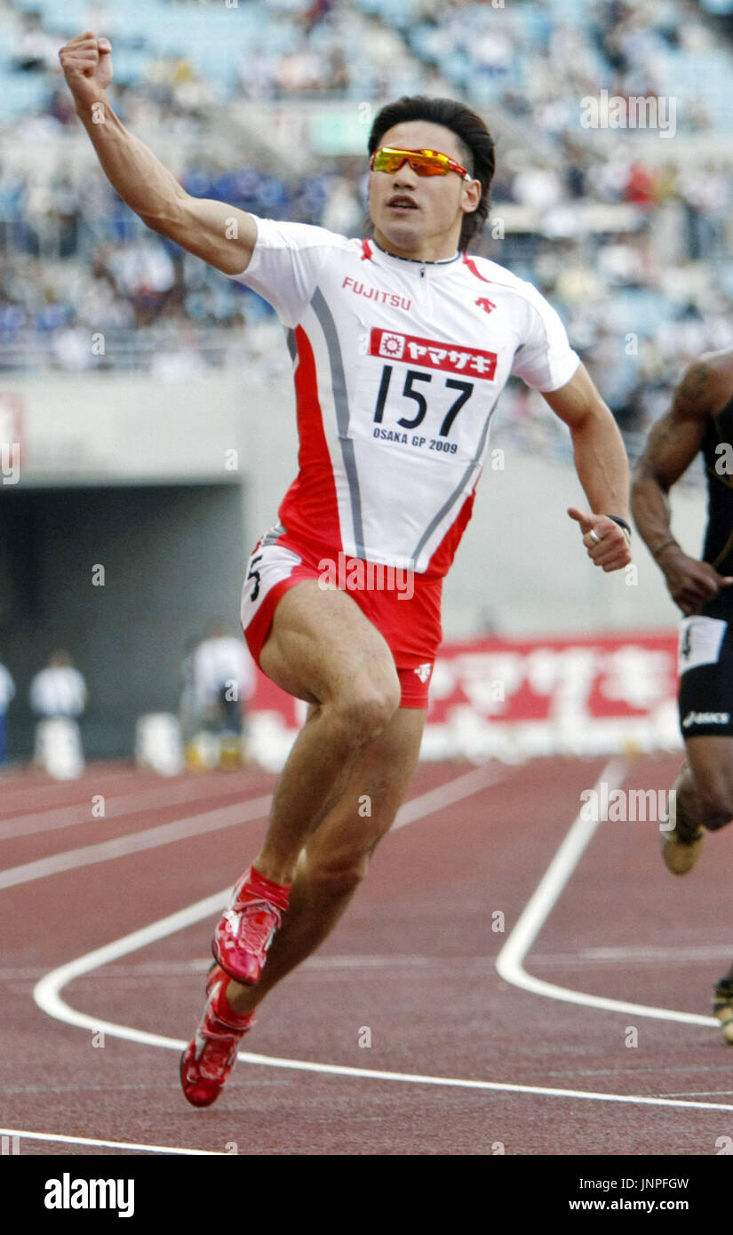 OSAKA, Japan - Japanese sprinter Naoki Tsukahara pumps the air after ...