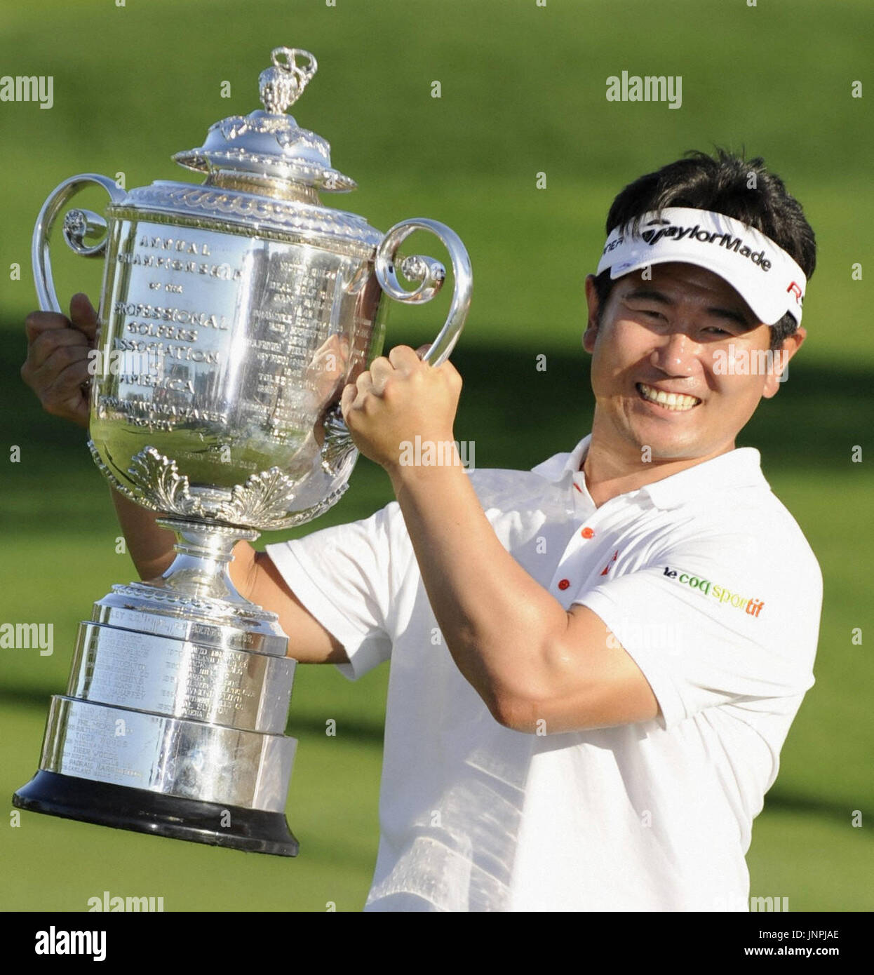 CHASKA, United States - South Korea's Y.E. Yang holds the trophy after ...