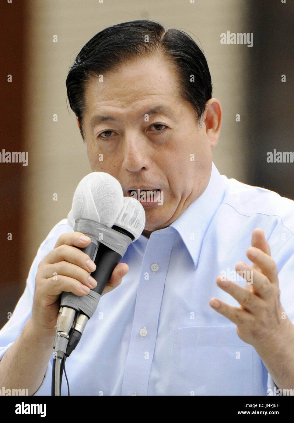 YOKOHAMA, Japan - New Komeito party leader Akihiro Ota stumps in ...