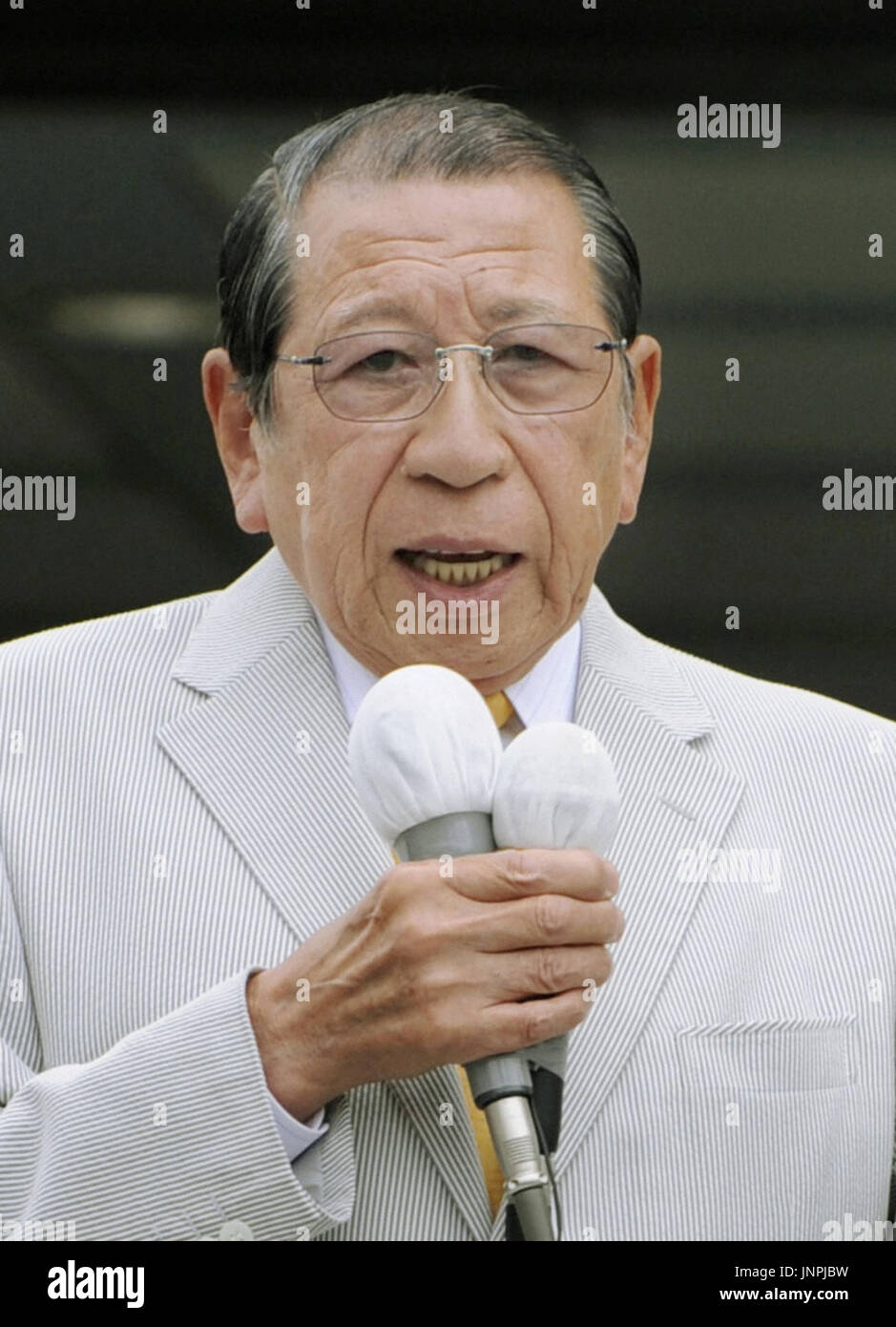 TOKYO, Japan - People's New Party leader Tamisuke Watanuki stumps in ...