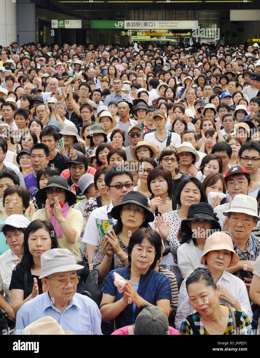 TOKYO, Japan - People mass near JR Akabane Station in Tokyo to hear a ...
