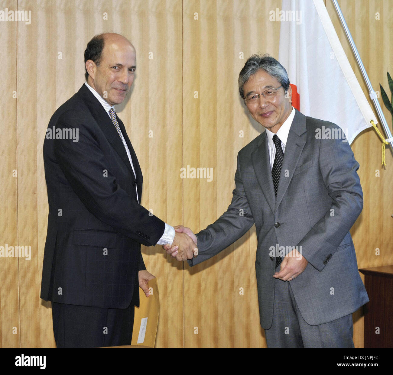 TOKYO, Japan - New U.S. Ambassador to Japan John Roos (L) shakes hands ...