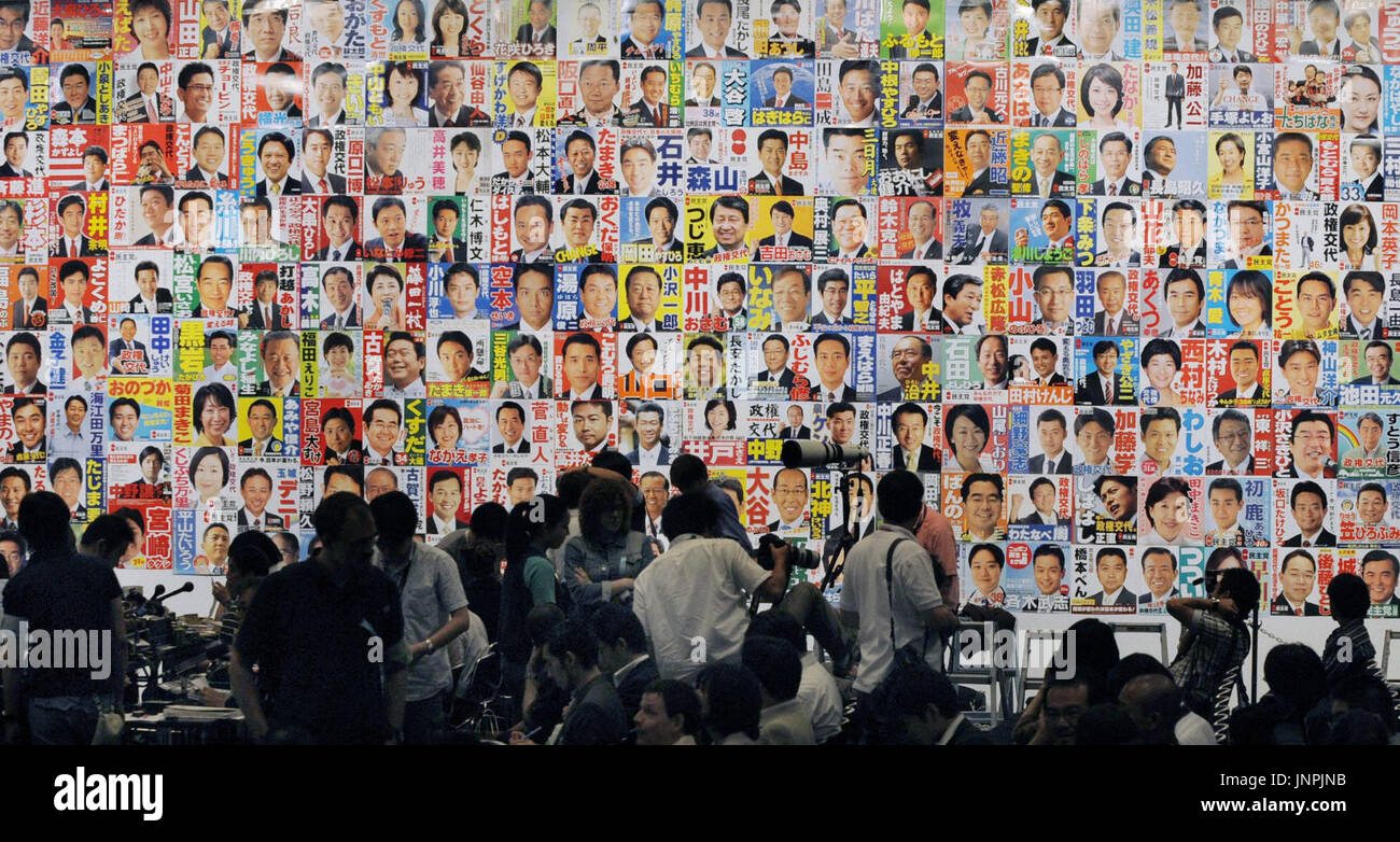 TOKYO, Japan - Posters of Democratic Party of Japan candidates cover a ...